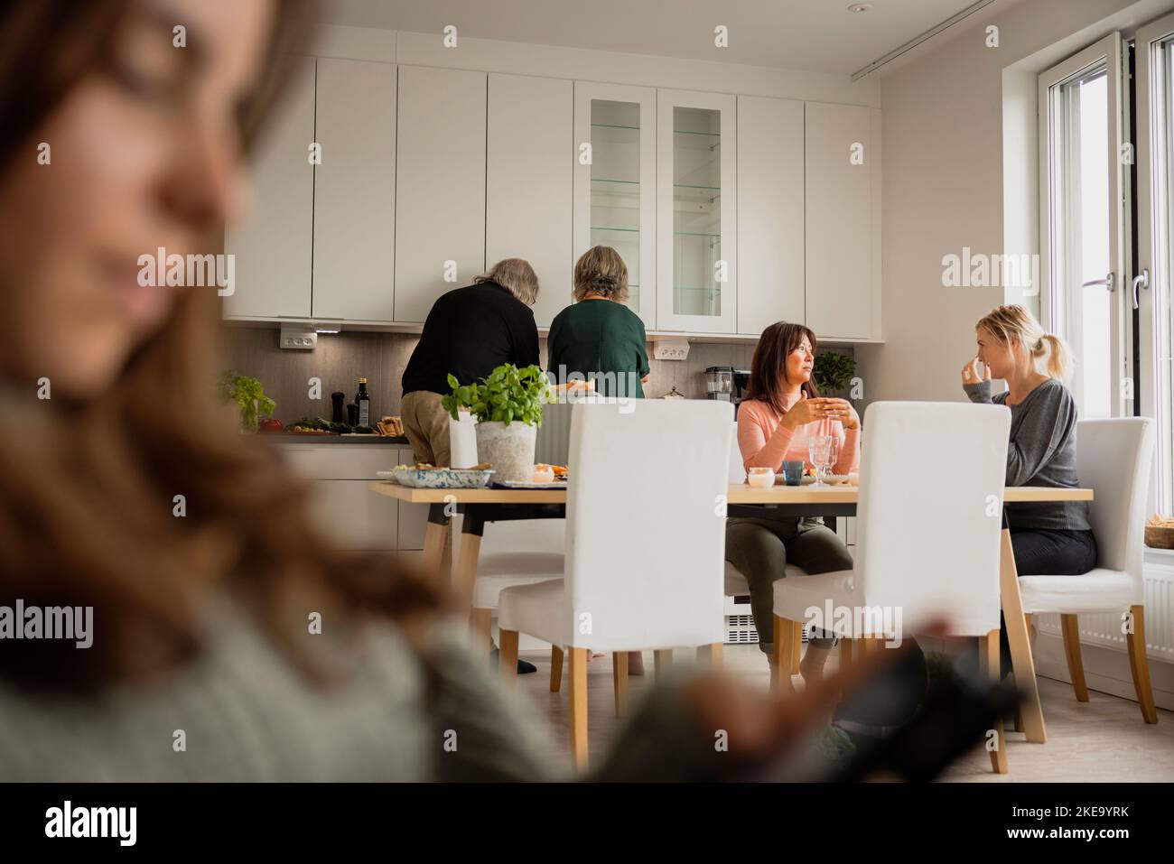 Family cleaning after having dinner Stock Photo - Alamy