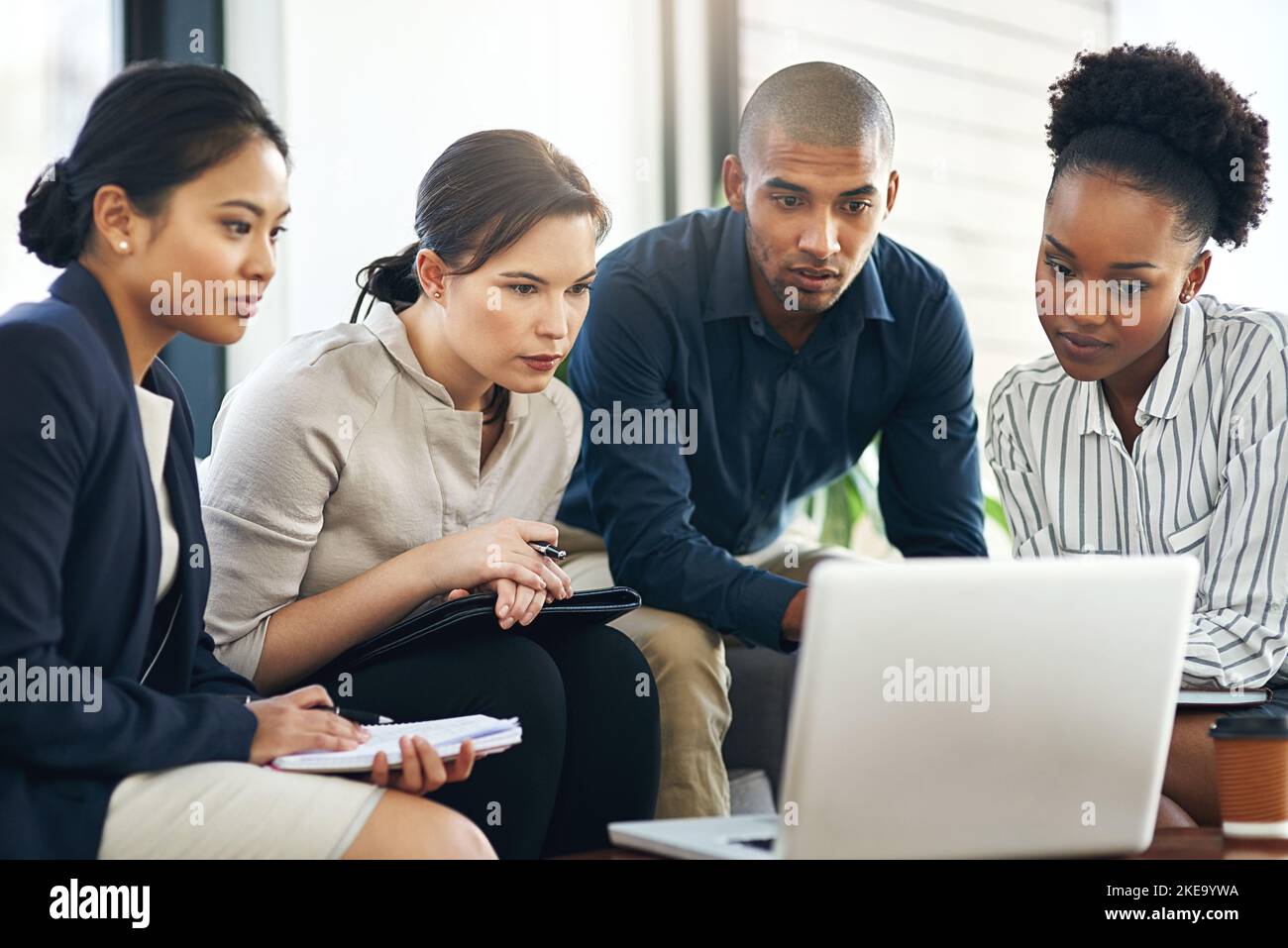 Getting down to strategy. a group of businesspeople talking together ...