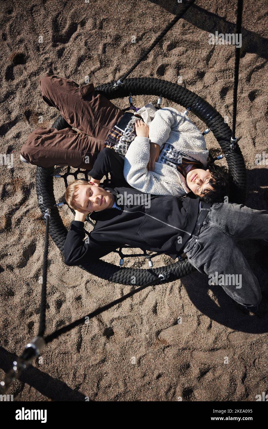 Teenage couple lying down hi-res stock photography and images - Alamy