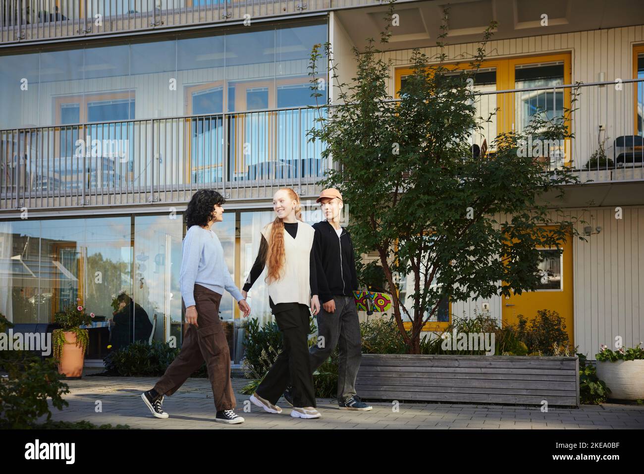 Friends hanging around together Stock Photo - Alamy