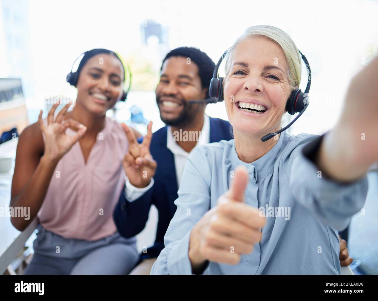 Call center, selfie and employees with hand sign for support ...