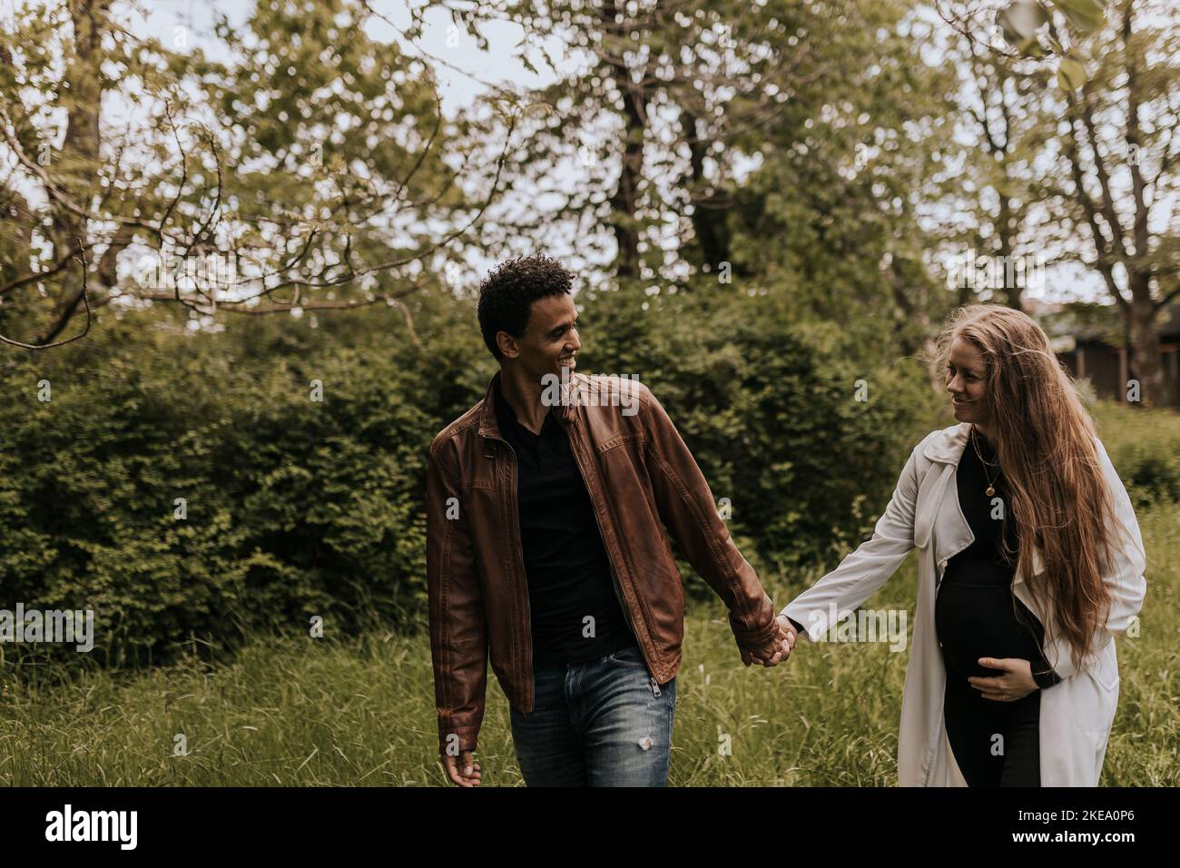 Smiling couple walking together Stock Photo - Alamy