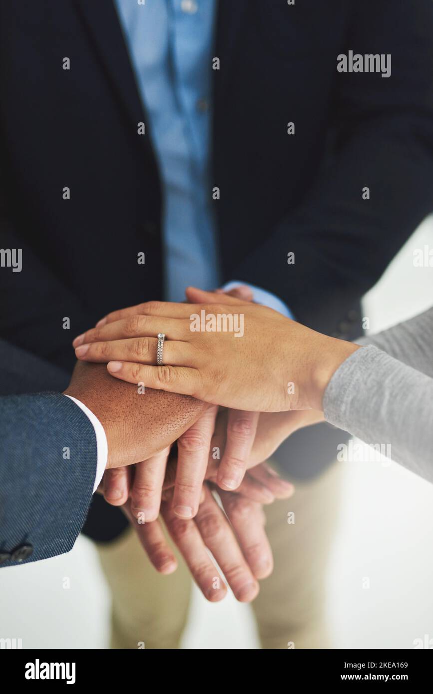 Build your dream with your team. a team of colleagues joining their ...