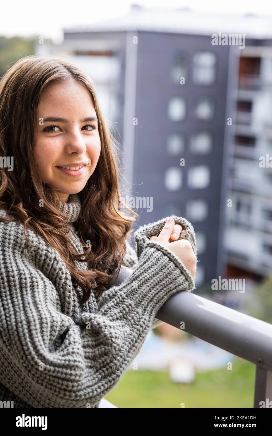 Portrait of teenage girl on balcony Stock Photo - Alamy