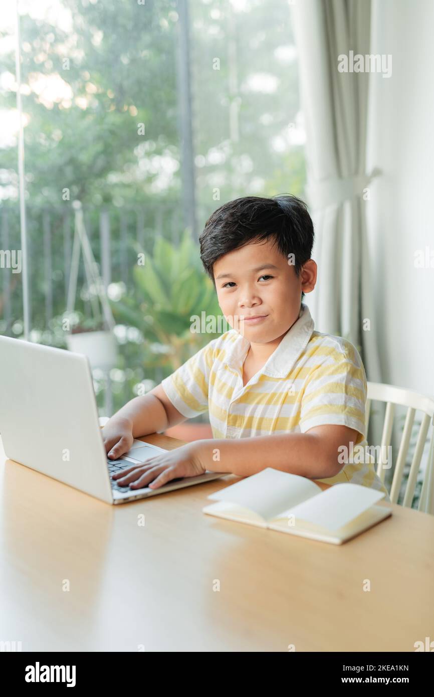 Boy student study online with video call teacher Stock Photo - Alamy