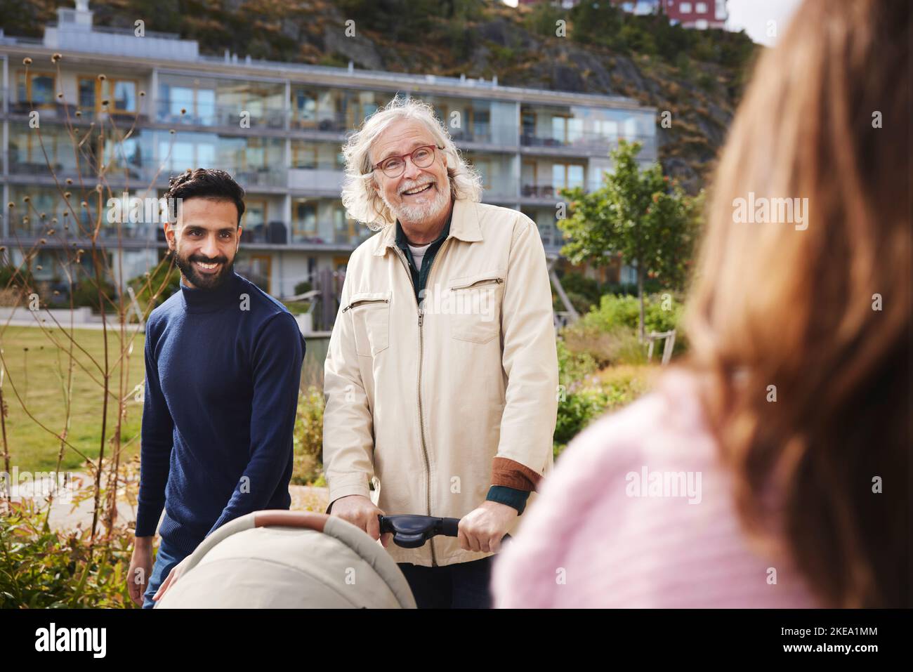 Men pushing pram Stock Photo - Alamy