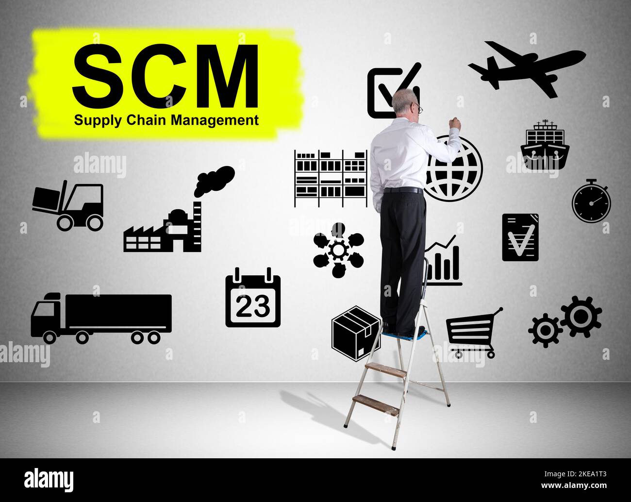 Man on a ladder drawing scm concept on a wall Stock Photo - Alamy