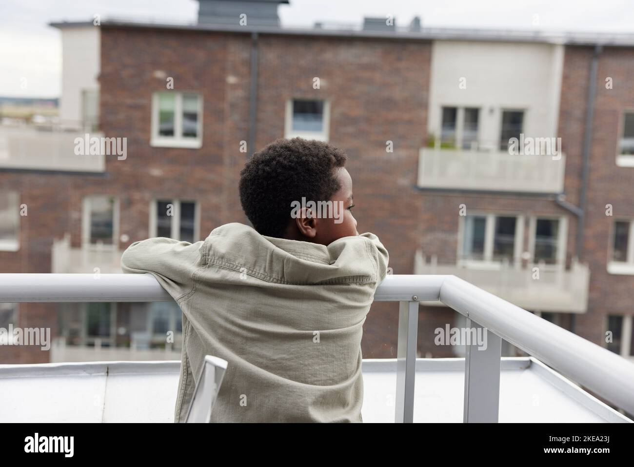Boy on balcony hi-res stock photography and images - Alamy