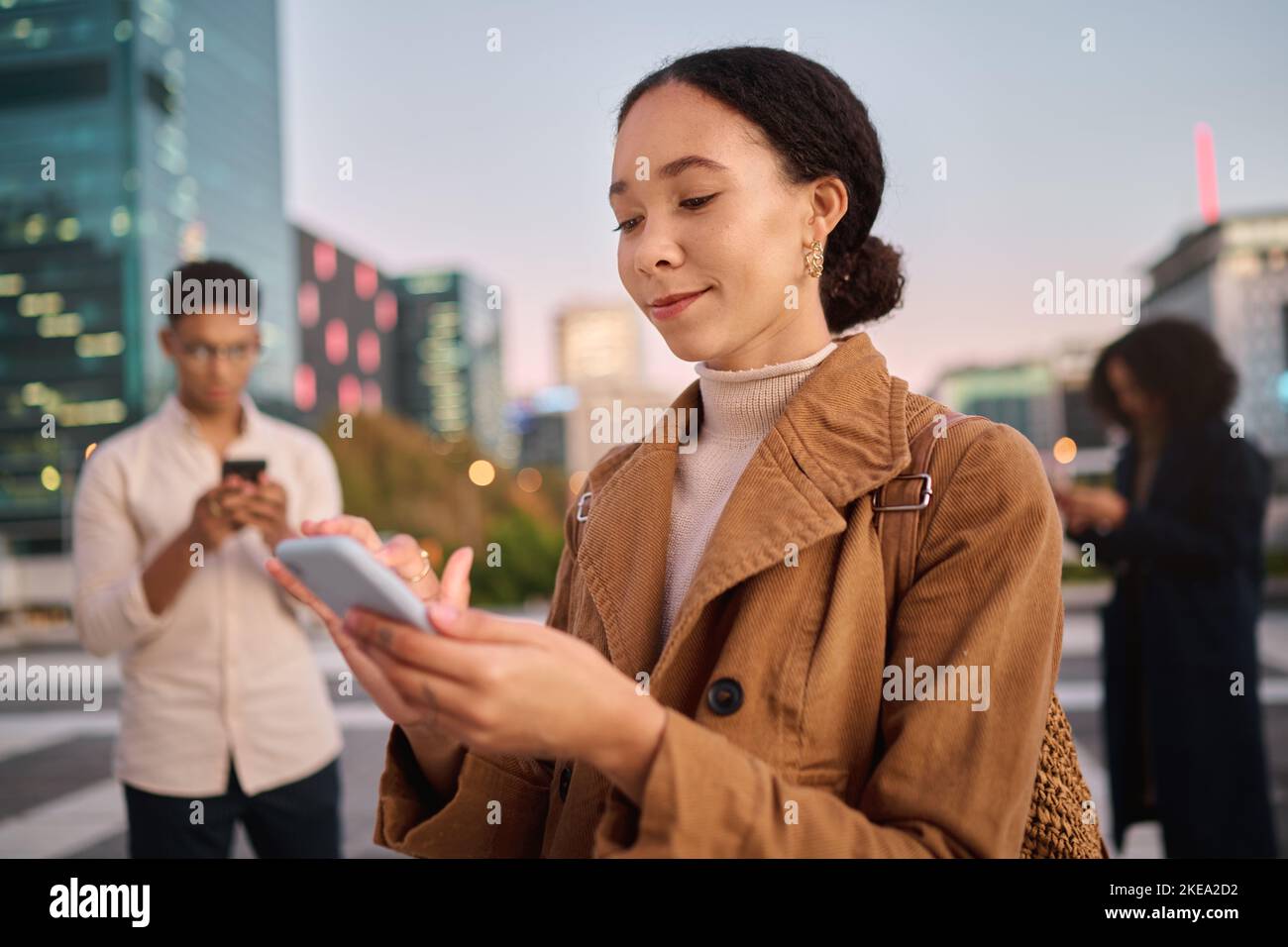 Phone, black woman and city with people using phone technology and 5g ...