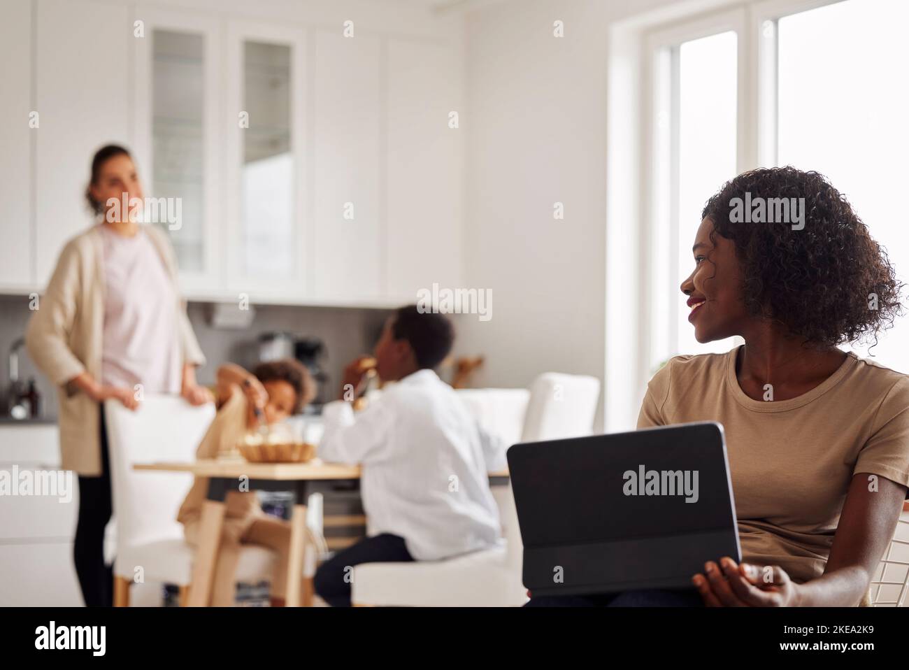 Family working and doing chores at home Stock Photo - Alamy