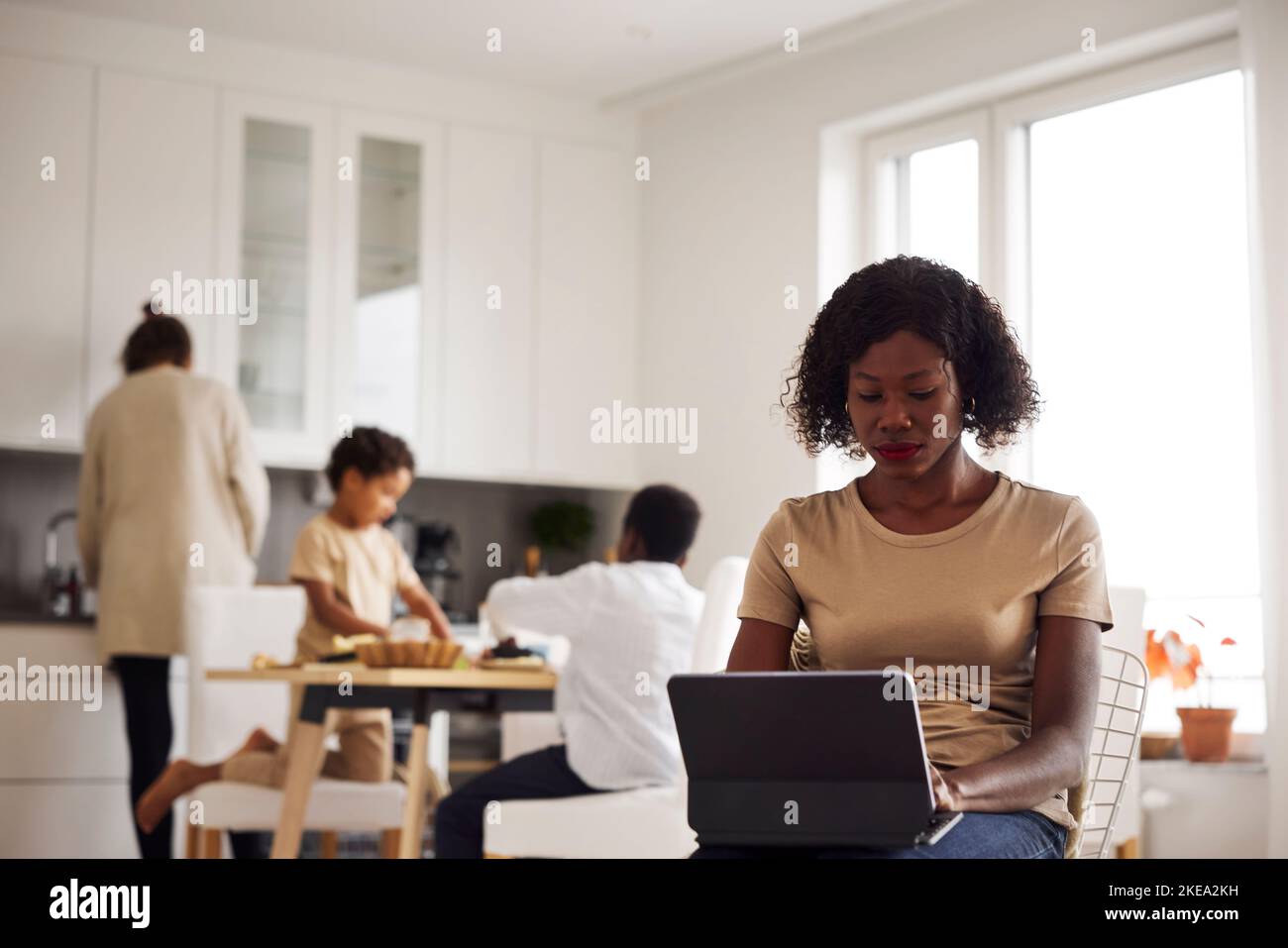 Family working and doing chores at home Stock Photo - Alamy