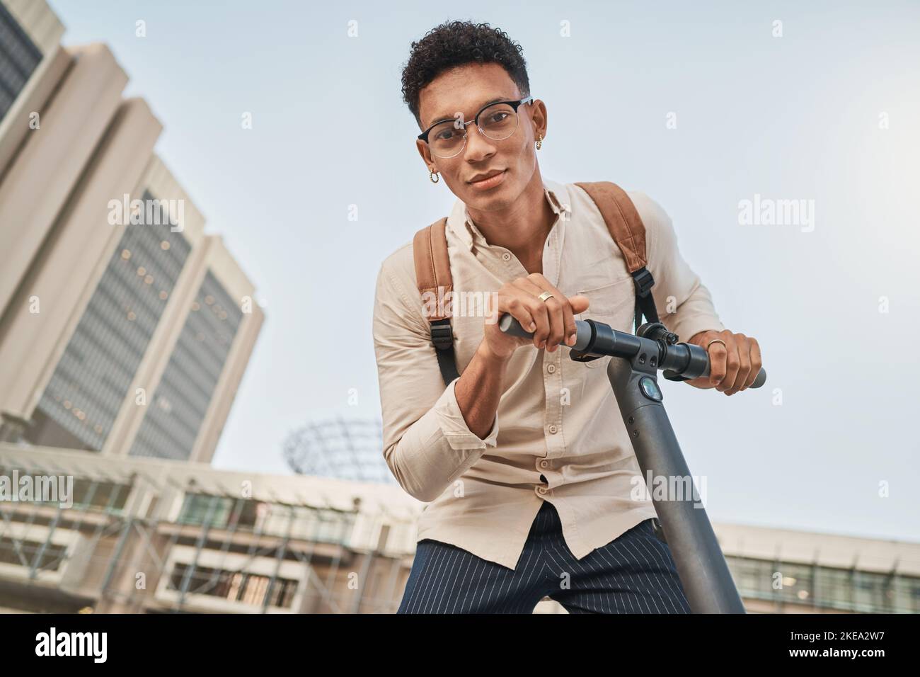 Scooter, city and portrait of a student man for travel and ...