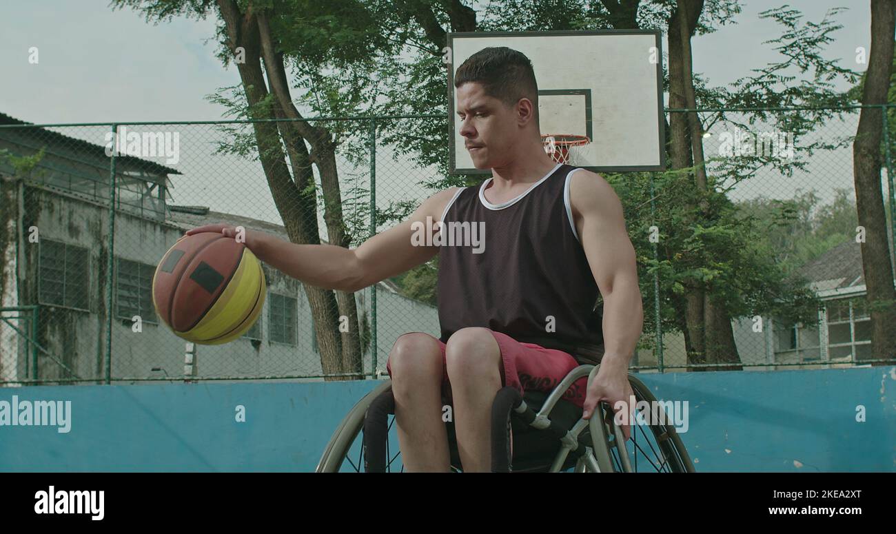One South American hispanic disabled athlete playing basketball ...