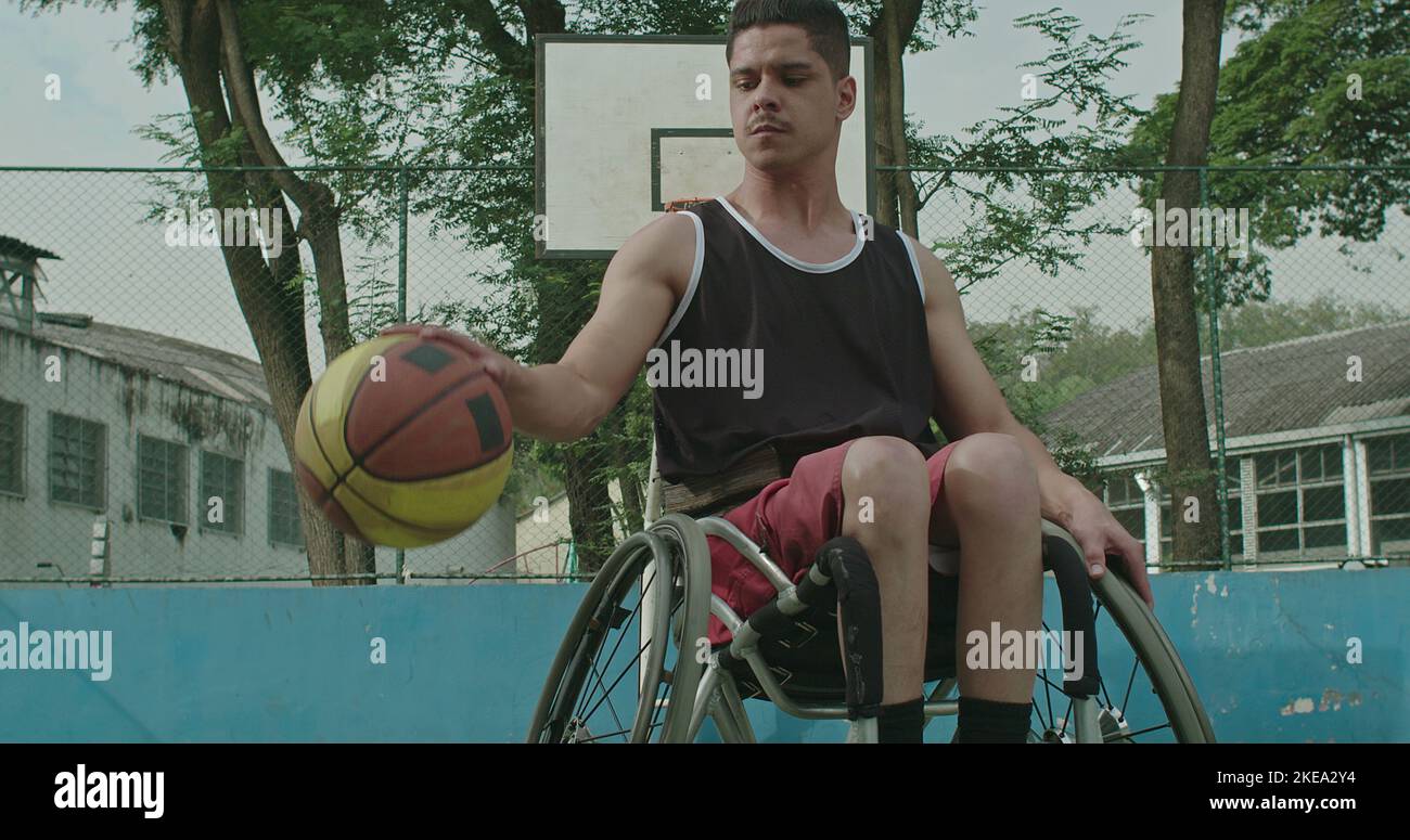 One South American hispanic disabled athlete playing basketball ...