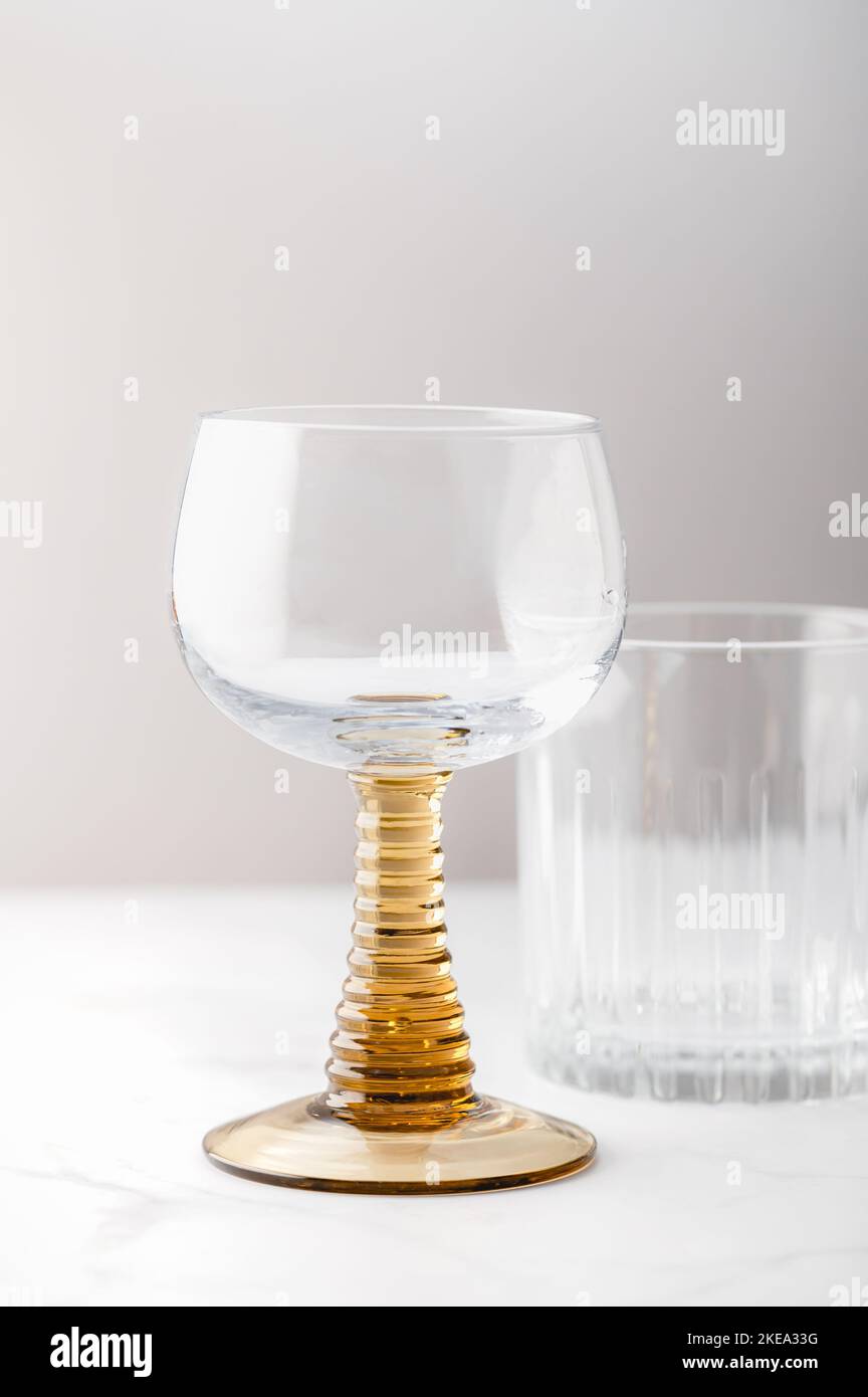 Empty glasses, light background Stock Photo - Alamy