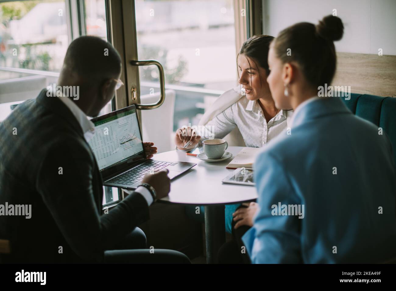 Three students conversating and discussing about their upcoming ...