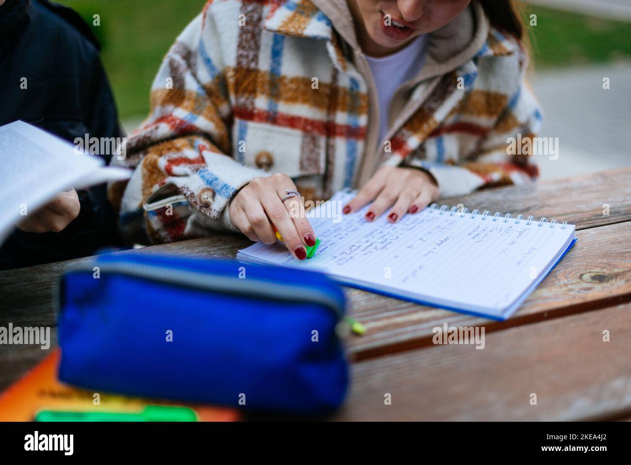 A high school student made a mistake while writing her homework. She is ...