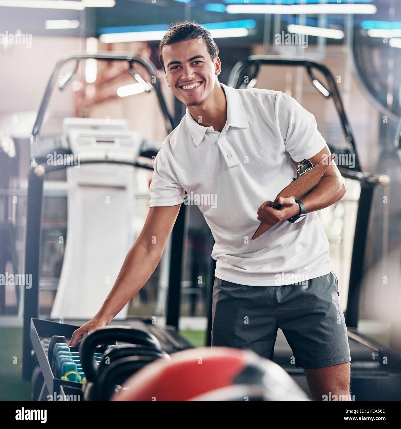 Training, portrait and fitness coach doing inspection of equipment at ...