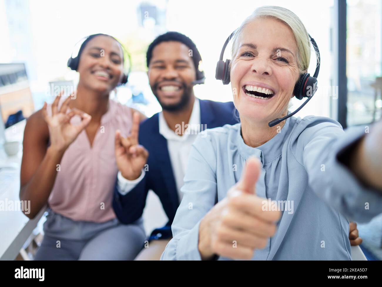 Call center, group and selfie with smile, hand sign or diversity in ...