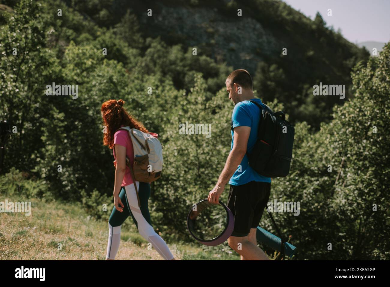 Yoga partners walking at the forest Stock Photo - Alamy