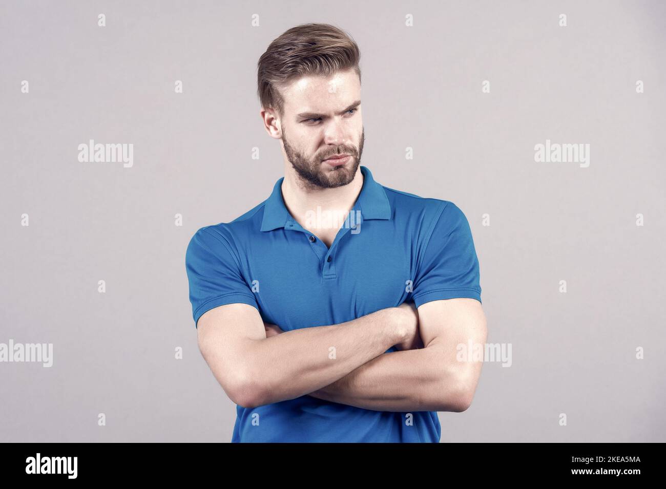 Man strict doubtful face posing confidently with folded crossed arms on ...
