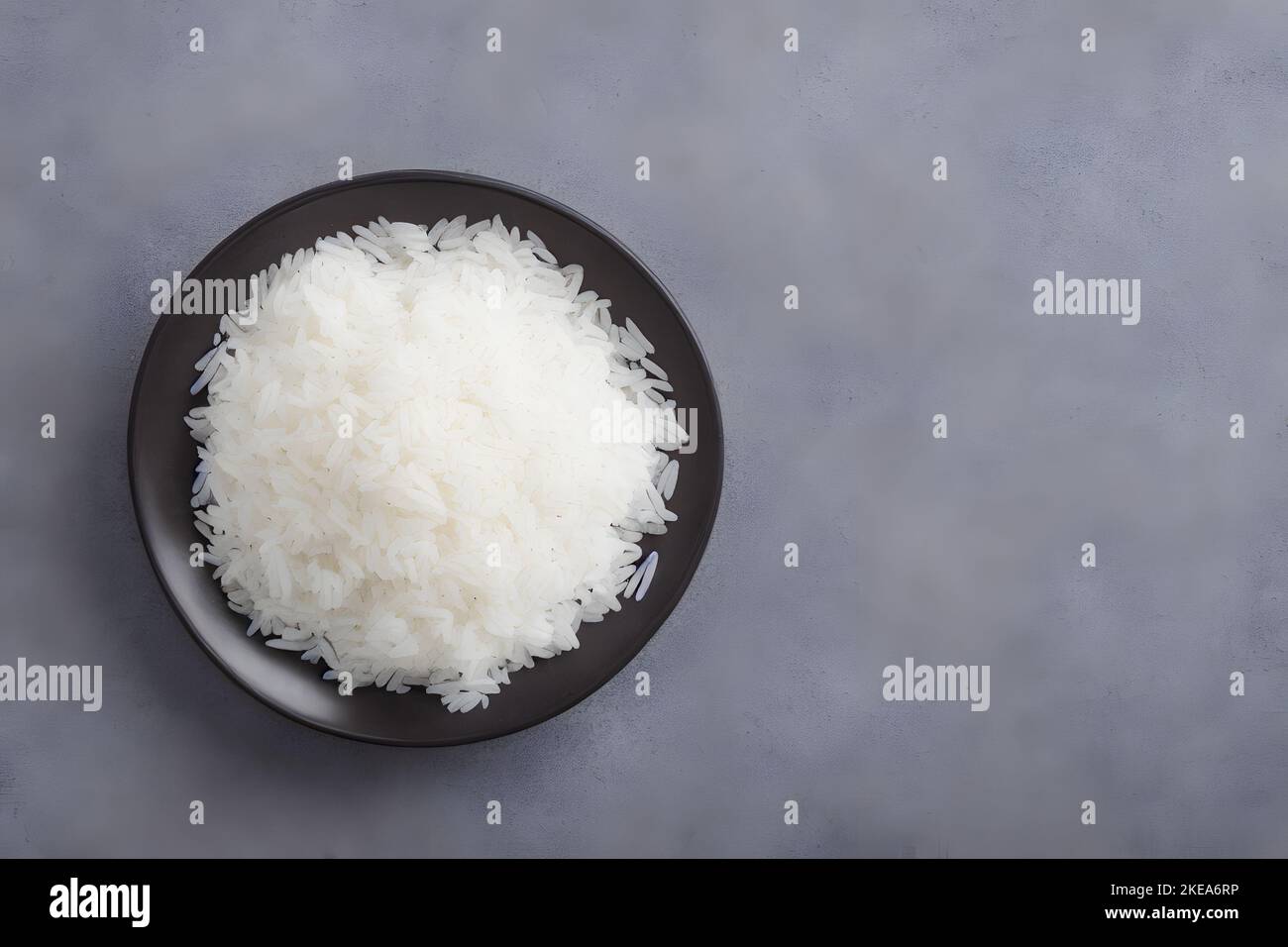 a cup of cooked rice, rice is a staple food high in carbohydrates Stock ...