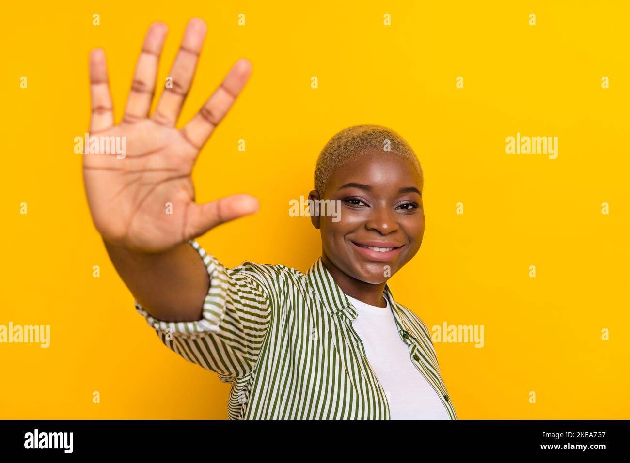 Portrait of friendly positive lady arm palm show high five waving hi ...