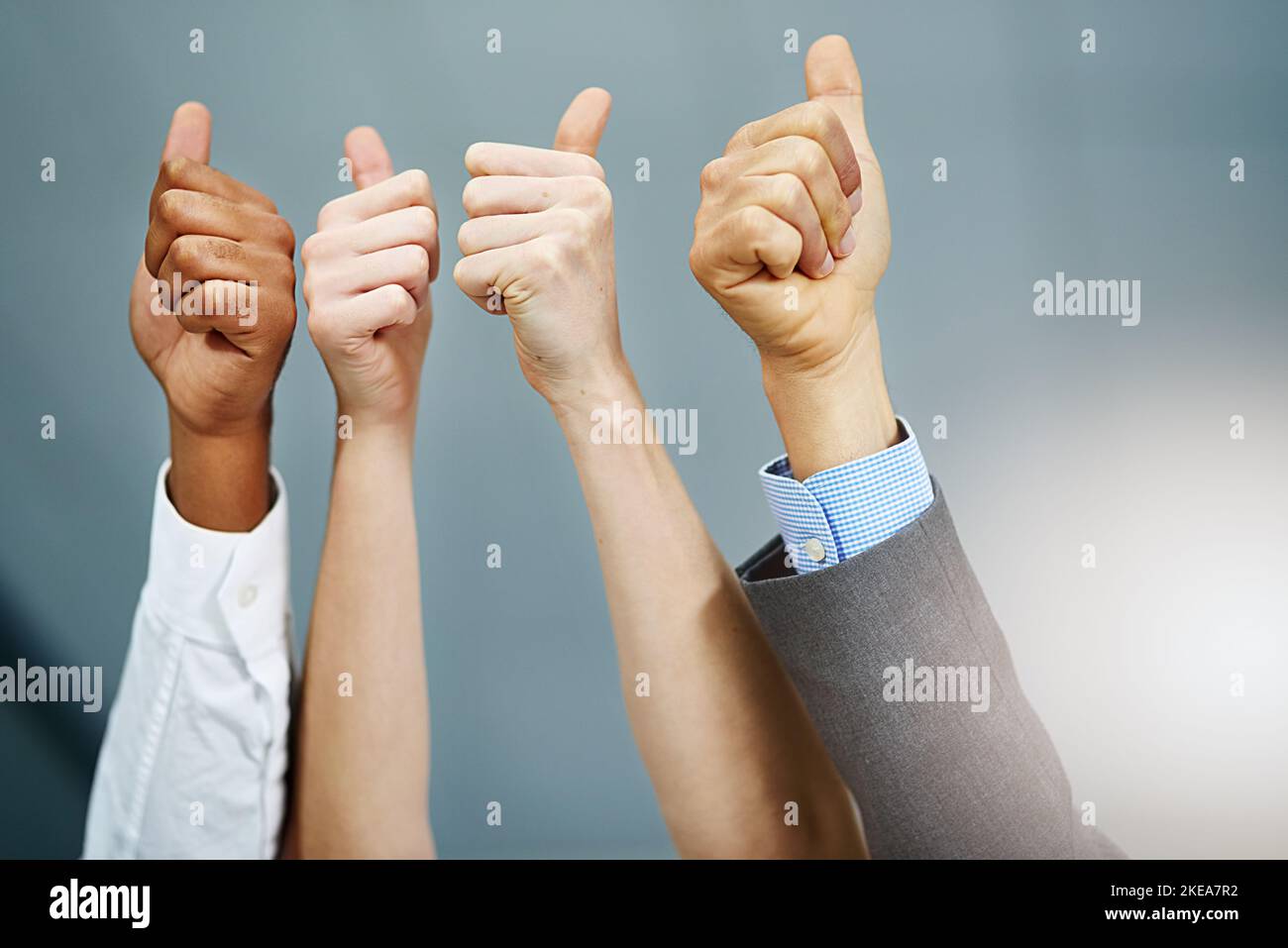 The thumbs of approval. a group of businesspeoples hands showing thumbs ...