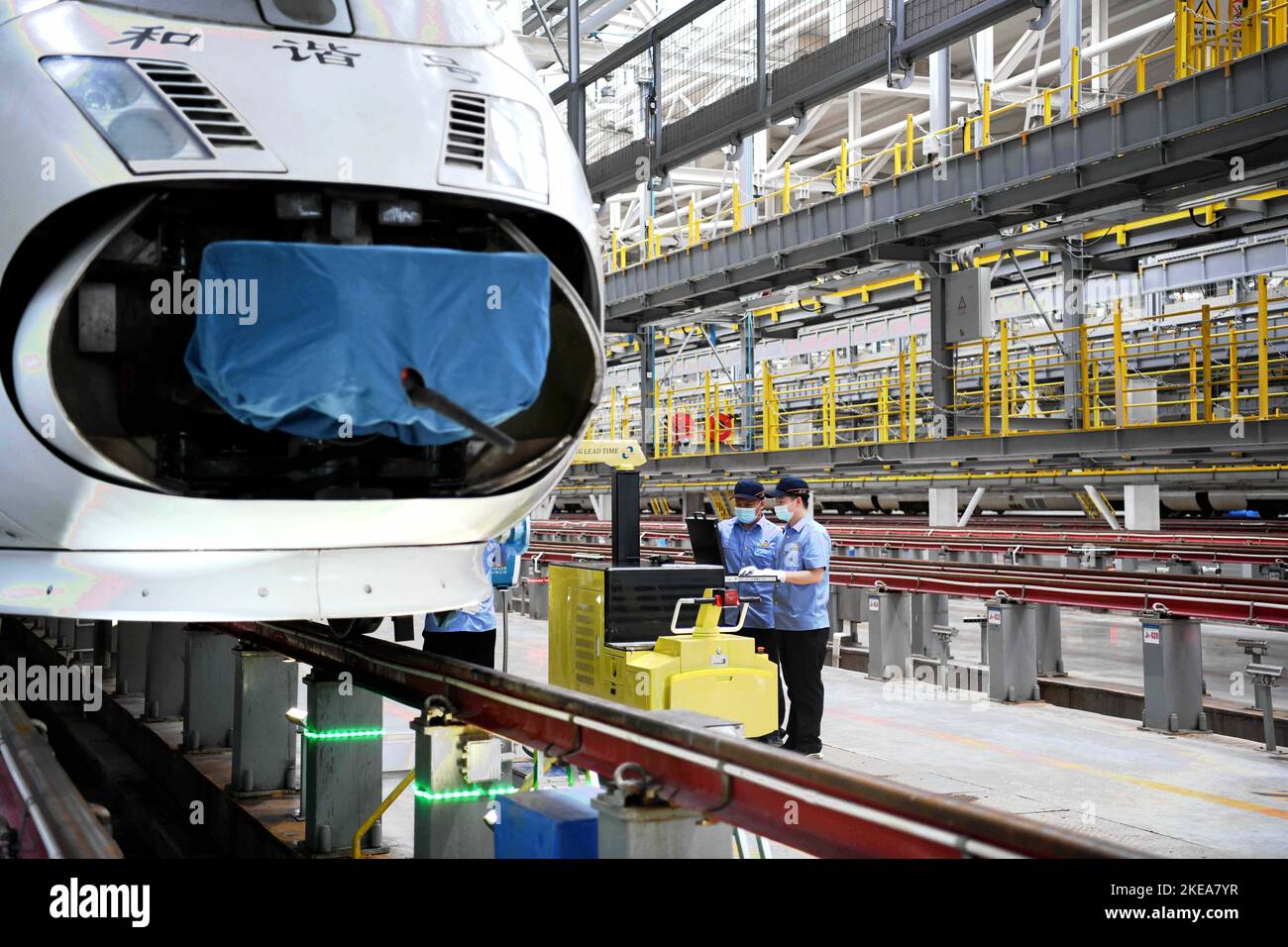 Workers are overhauling the EMU(Electrical Multiple Unit) in accordance ...