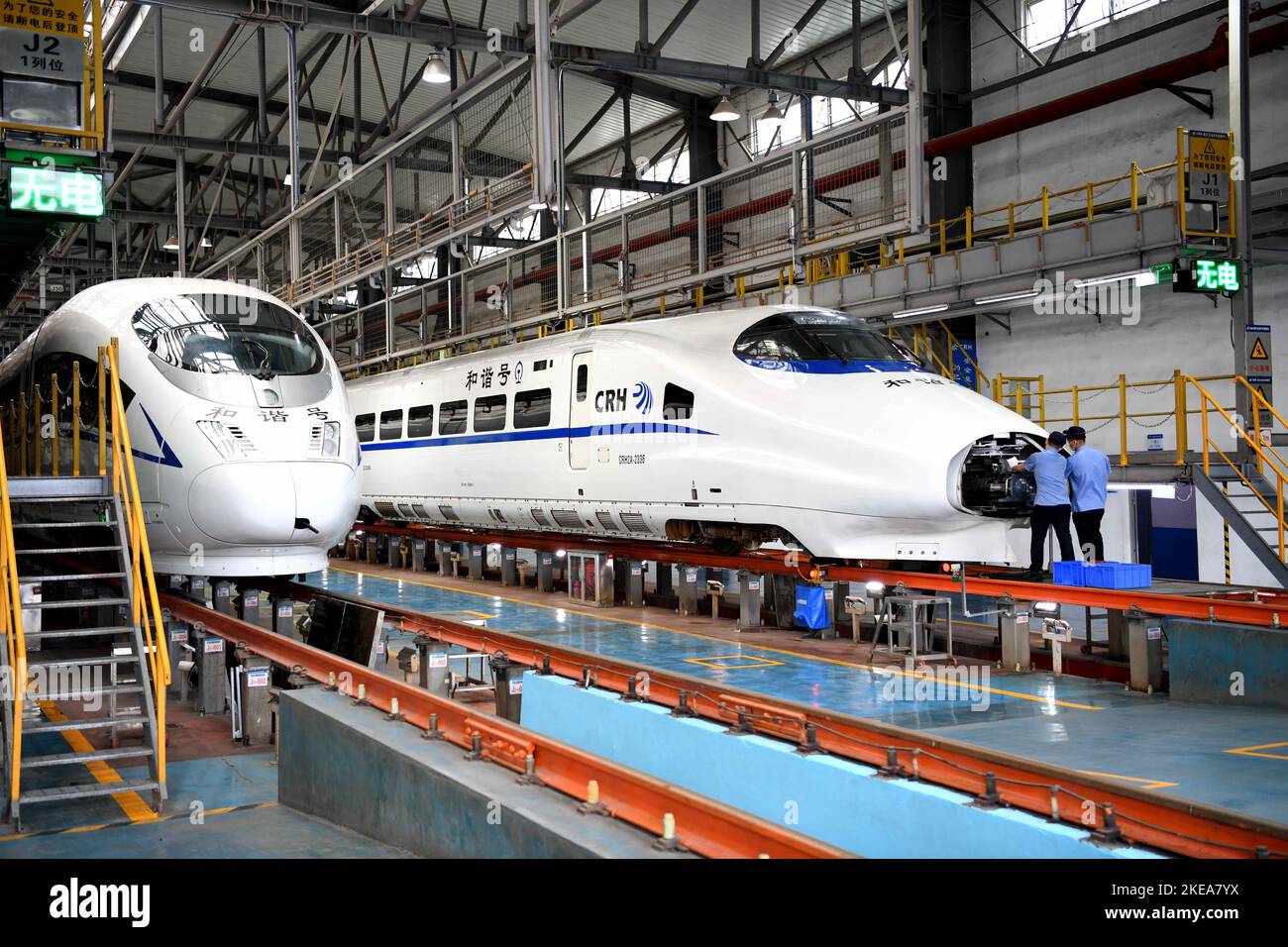 Workers are overhauling the EMU(Electrical Multiple Unit) in accordance with operating standards ...