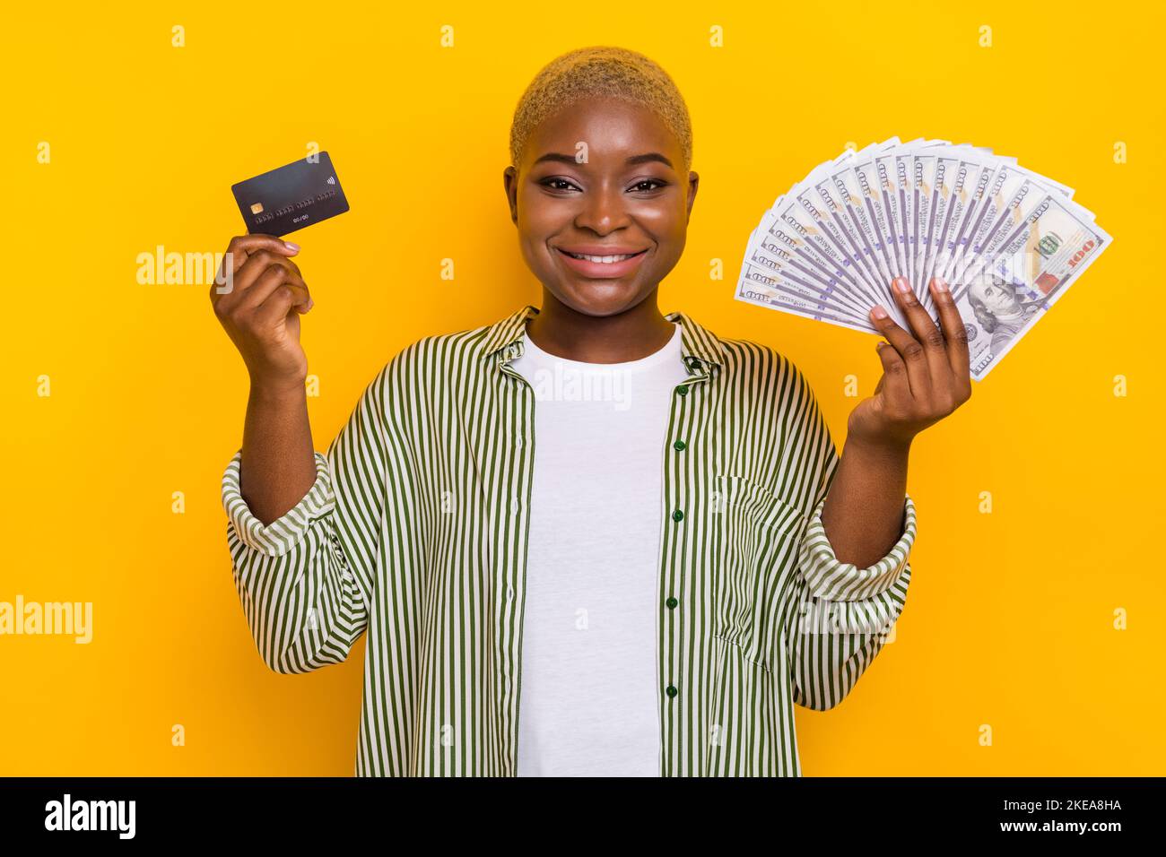 Portrait of cheerful charming person hands hold debit card usd ...