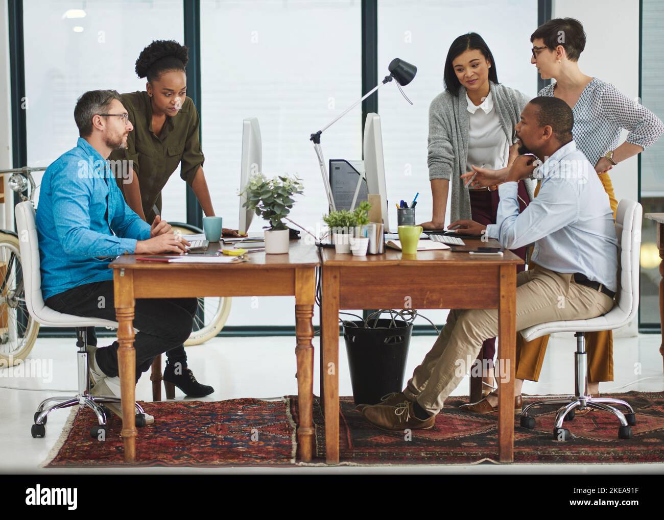 An ordinary day in the office. Full length shot of a group of ...