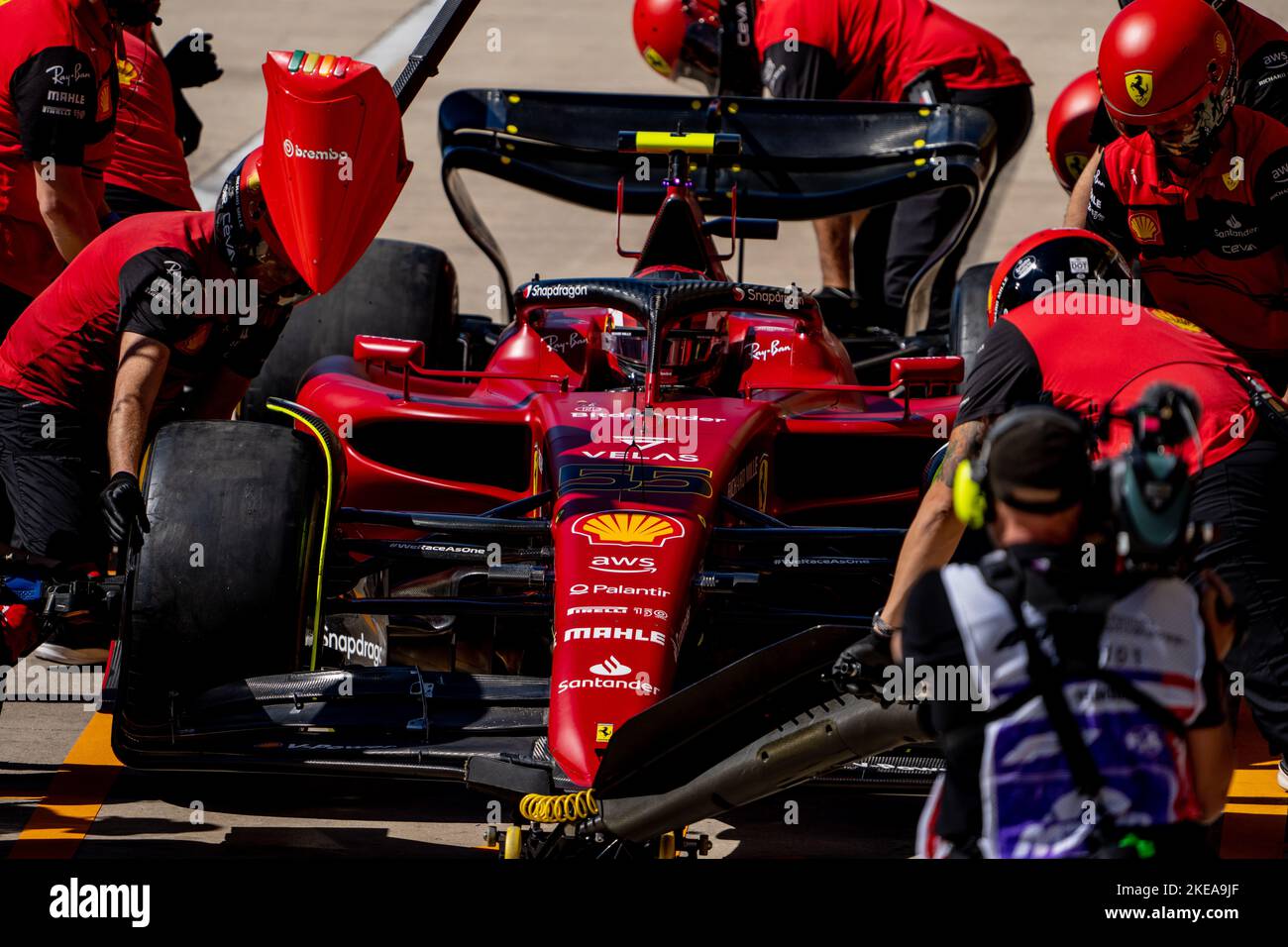 A red race car on the track during Formula 1 racing competition in ...