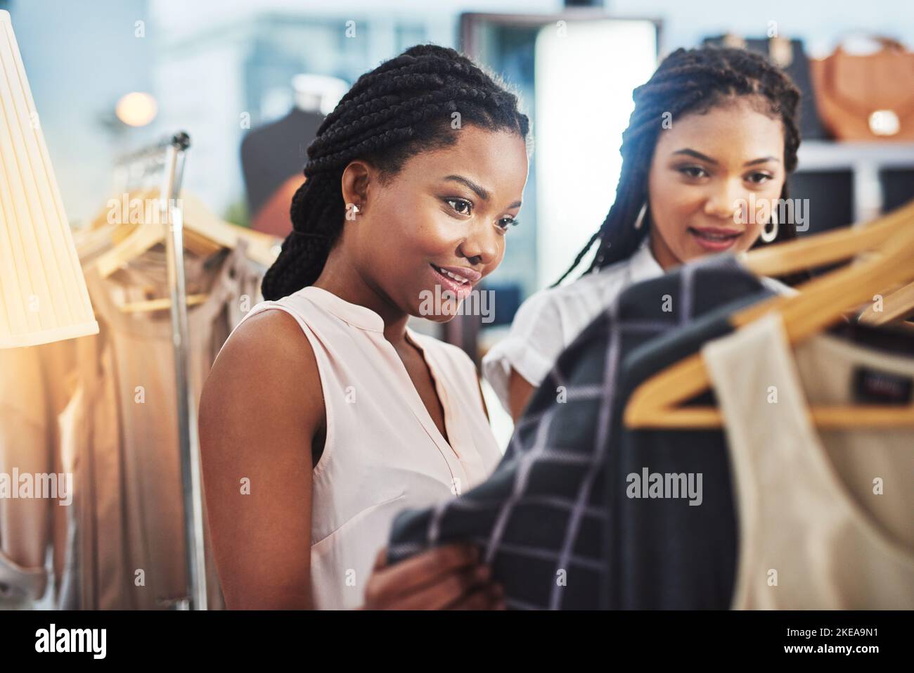 Shopping is the answer, nevermind the question. two women looking at ...