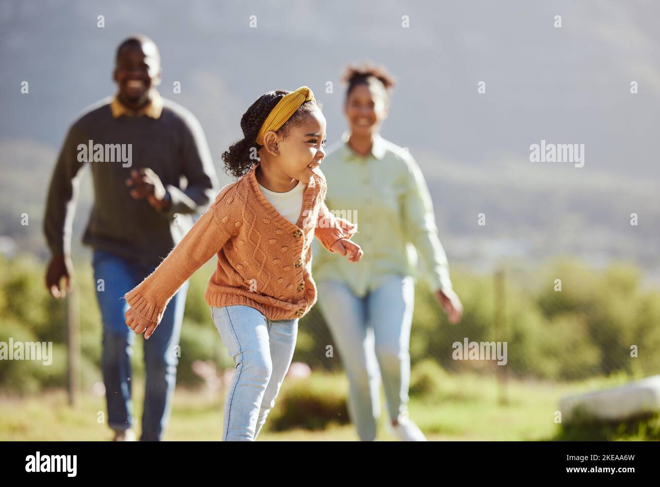 Black family, fun child and parents running, chasing and enjoy bonding ...