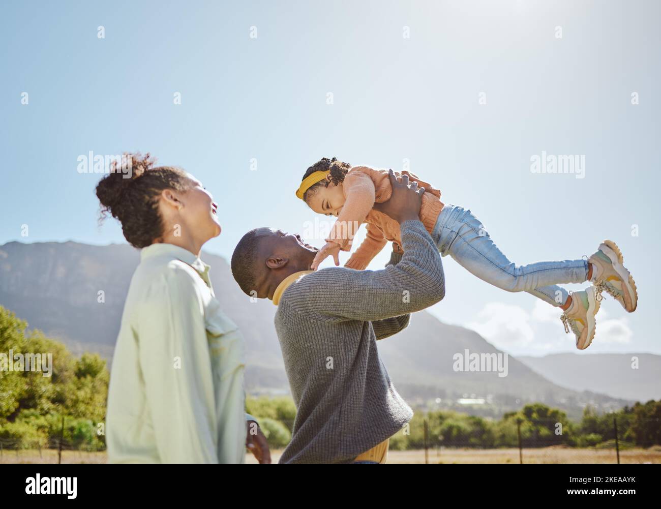 Black family, nature and parents play with child on weekend countryside ...