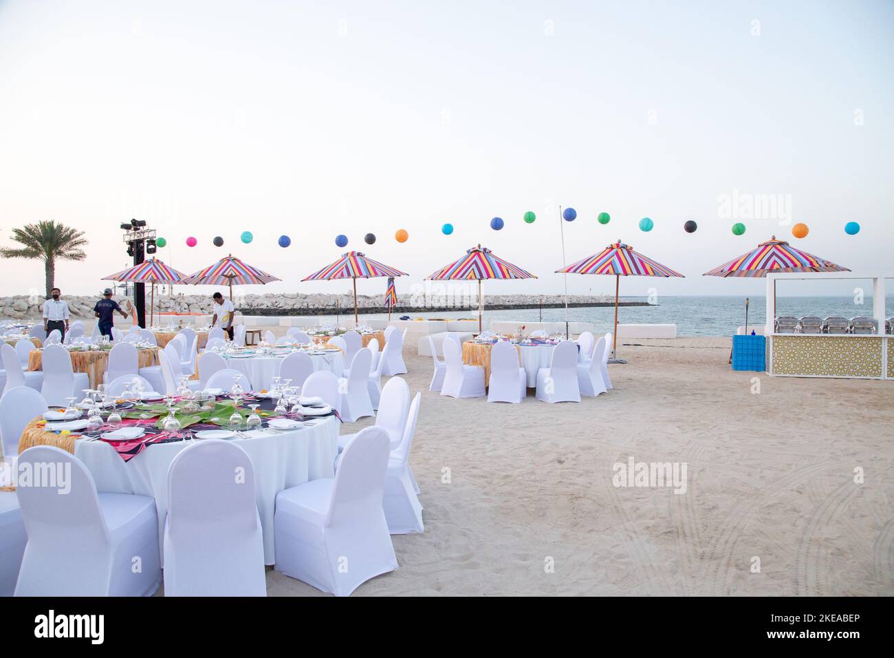 table setting at sunset outside on beach Stock Photo - Alamy