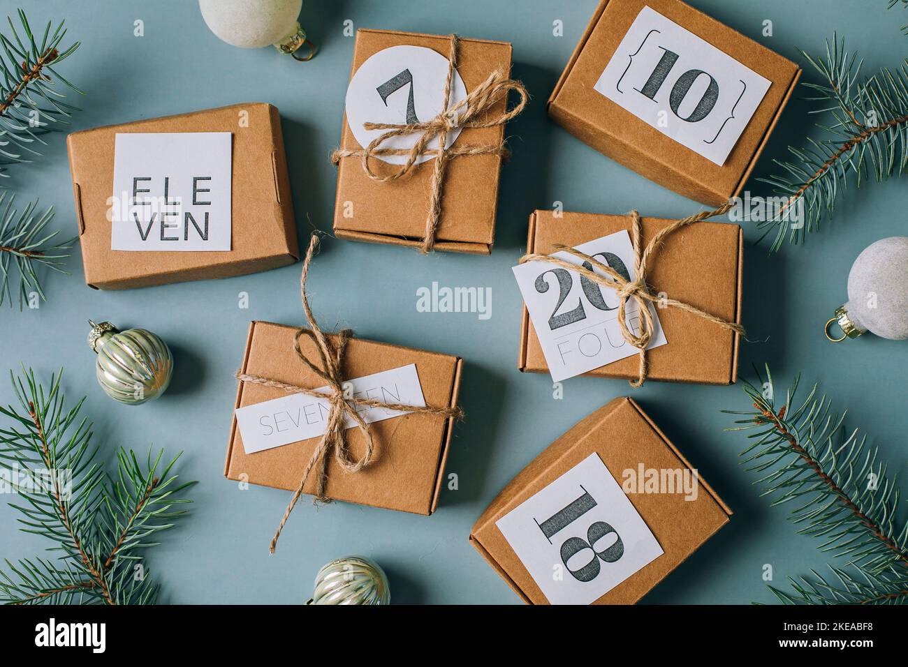 Advent calendar craft gift boxes on blue background. Sustainable ...
