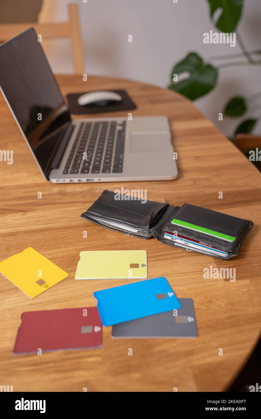 Credit cards in the wallet laptop open access for online shopping in a ...