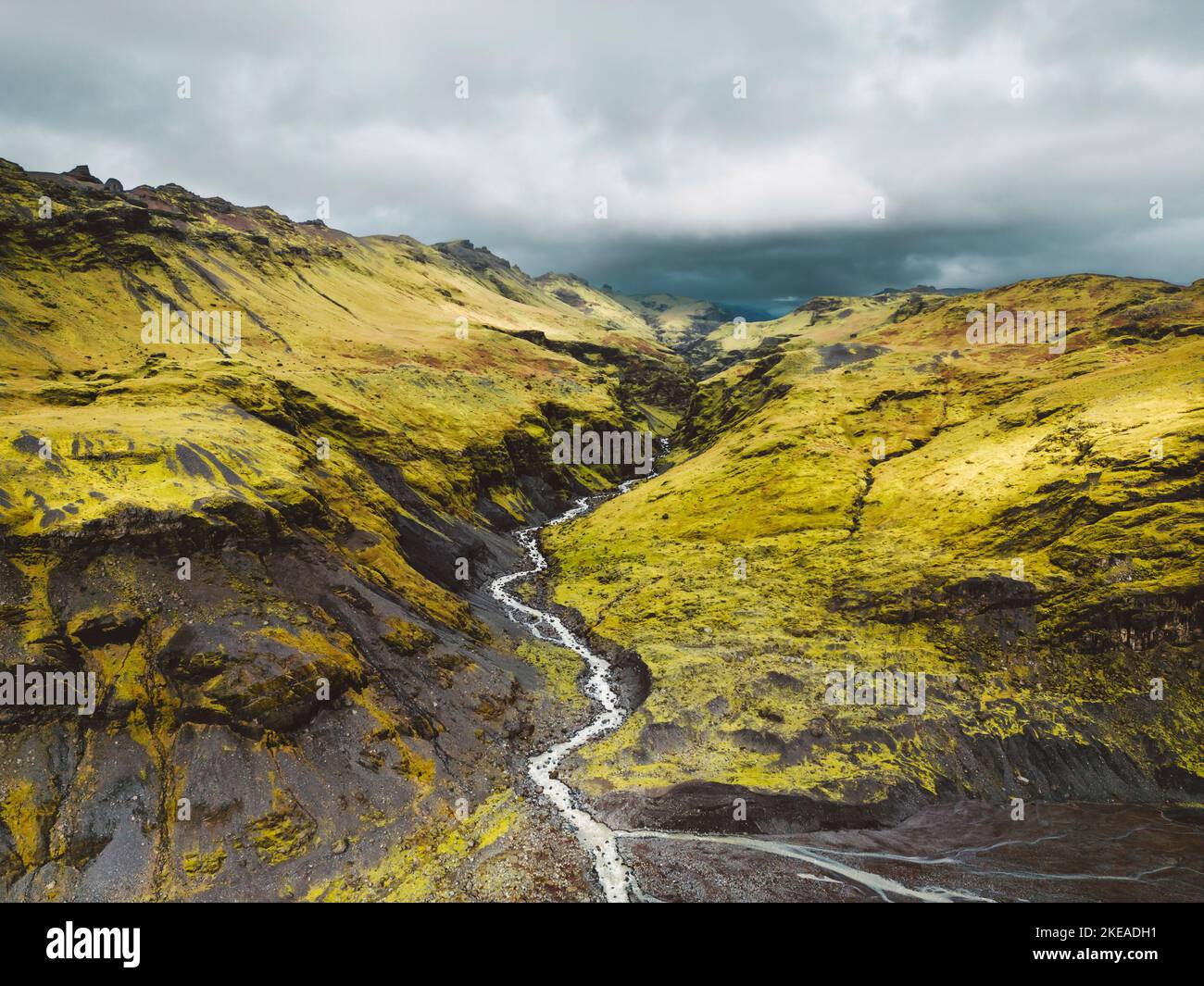 Glacier River flowing trough volcanic Icelandic landscape - cliffs and ...