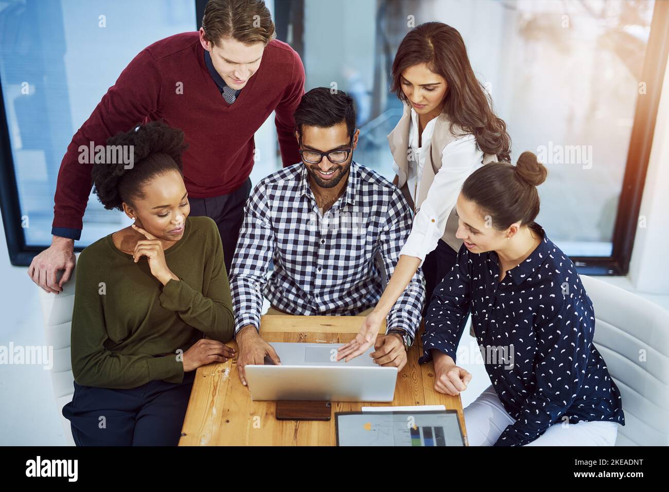 Presenting their idea to their manager. a group of designers discussing ...