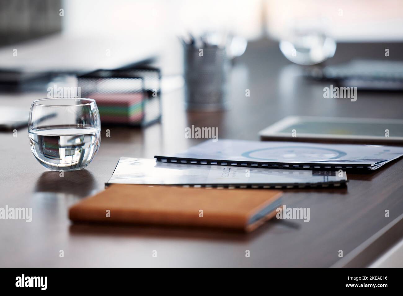 Notebook with documents, desk in office interior and zoom on business ...