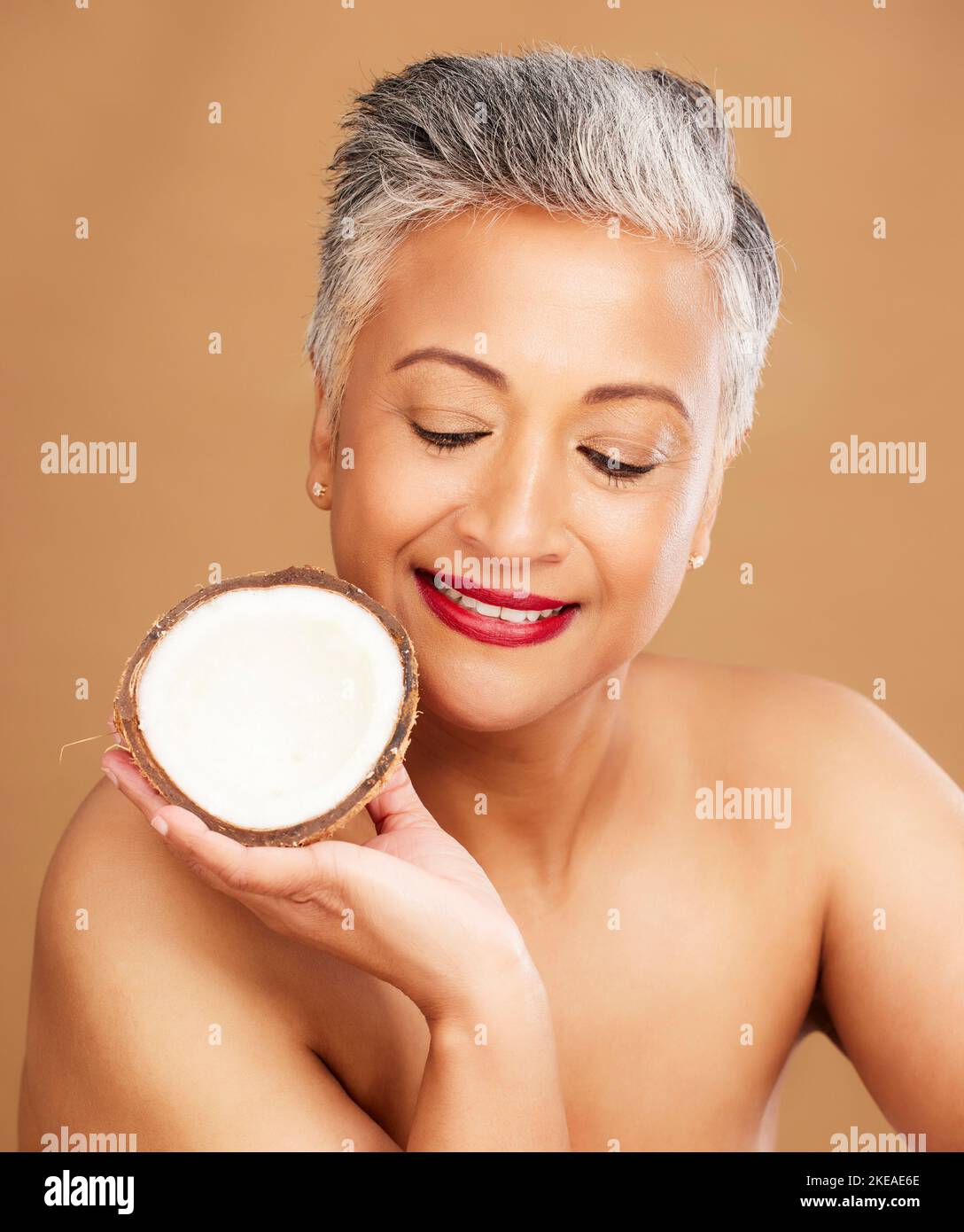 Beauty, coconut and skincare with woman in natural cosmetic product ...