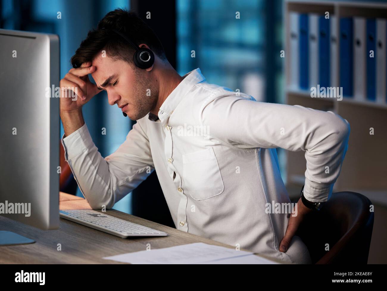 Businessman, call center and back pain from burnout, headache or ...