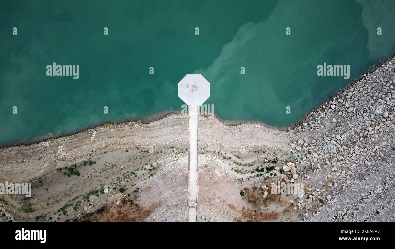 Aerial drone view of low levels of the dam river. Shortage of water ...