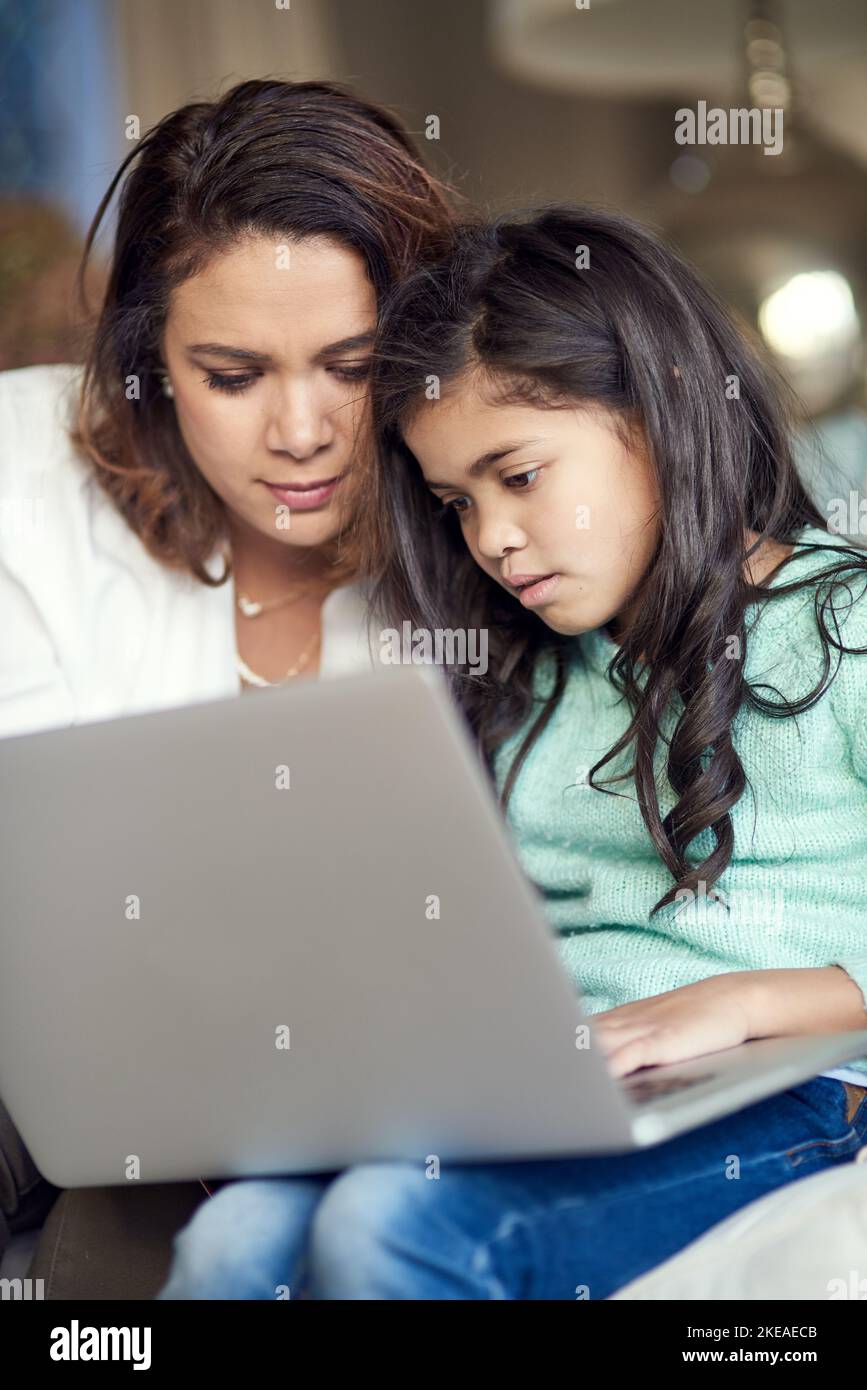 Integrating technology into their home. a little girl and her mother ...