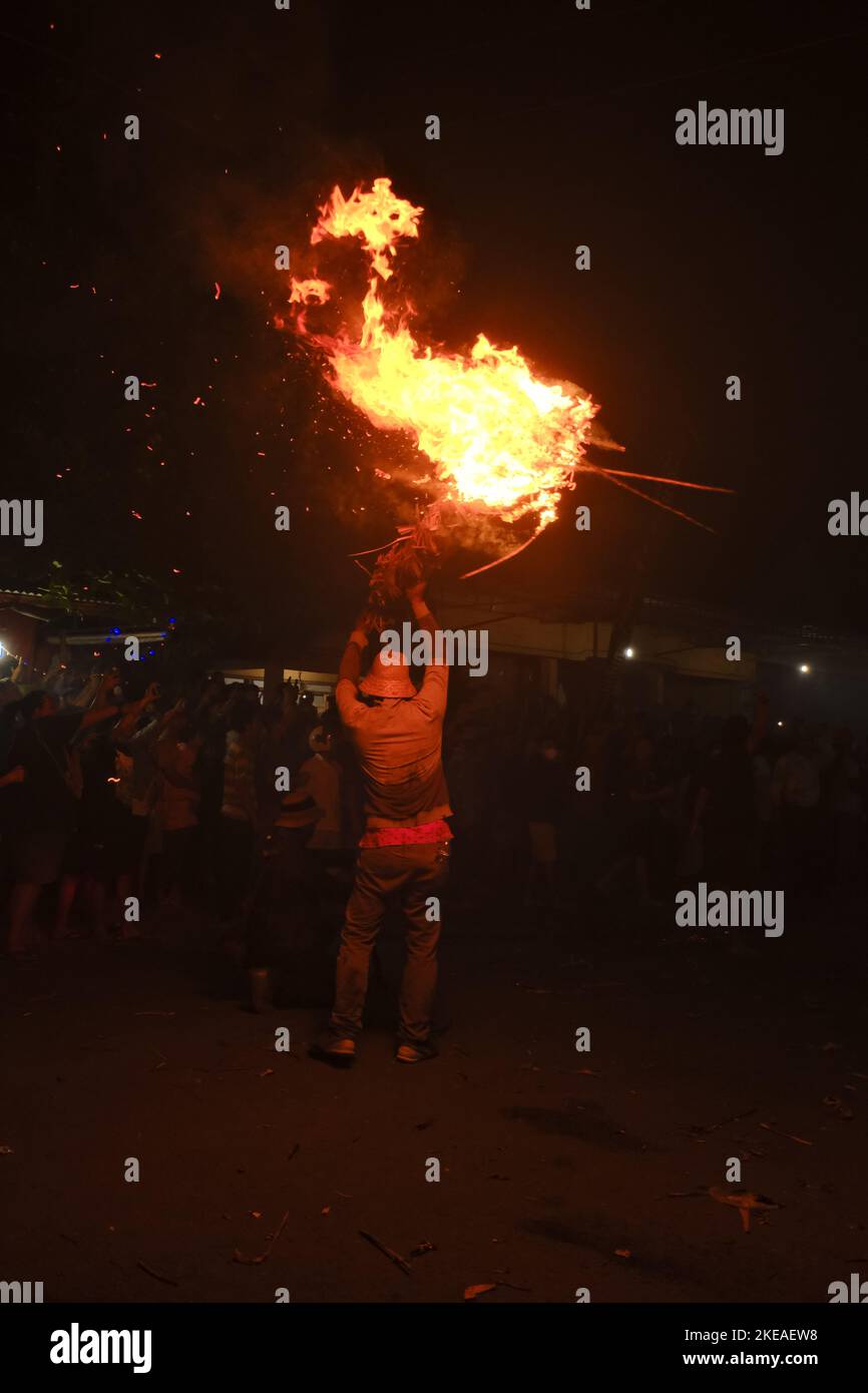 A traditional culture that uses a torch from coconut leaves and lit it ...