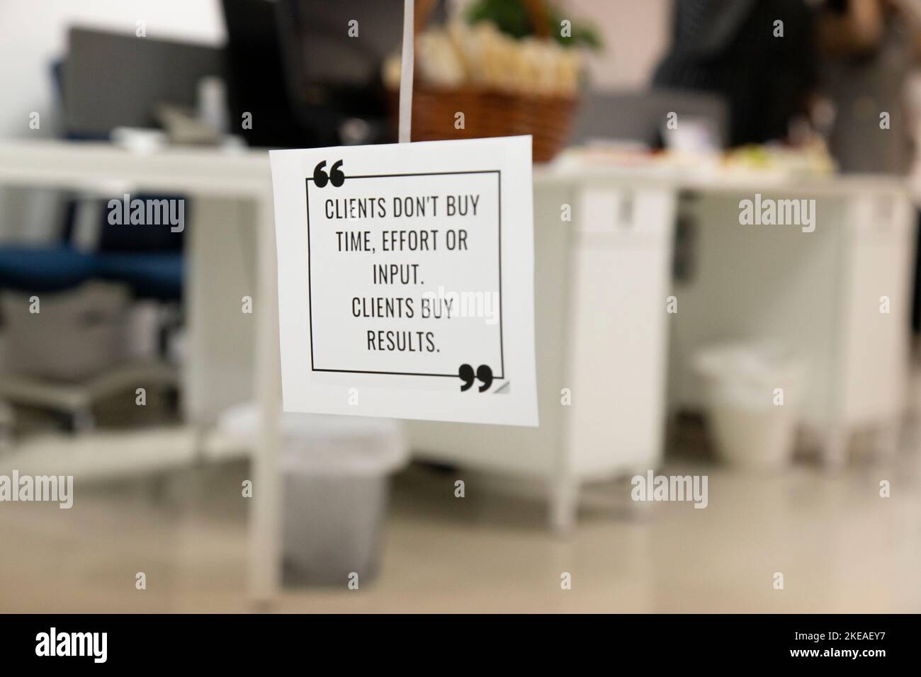 inspirational quote on string with office at back Stock Photo - Alamy