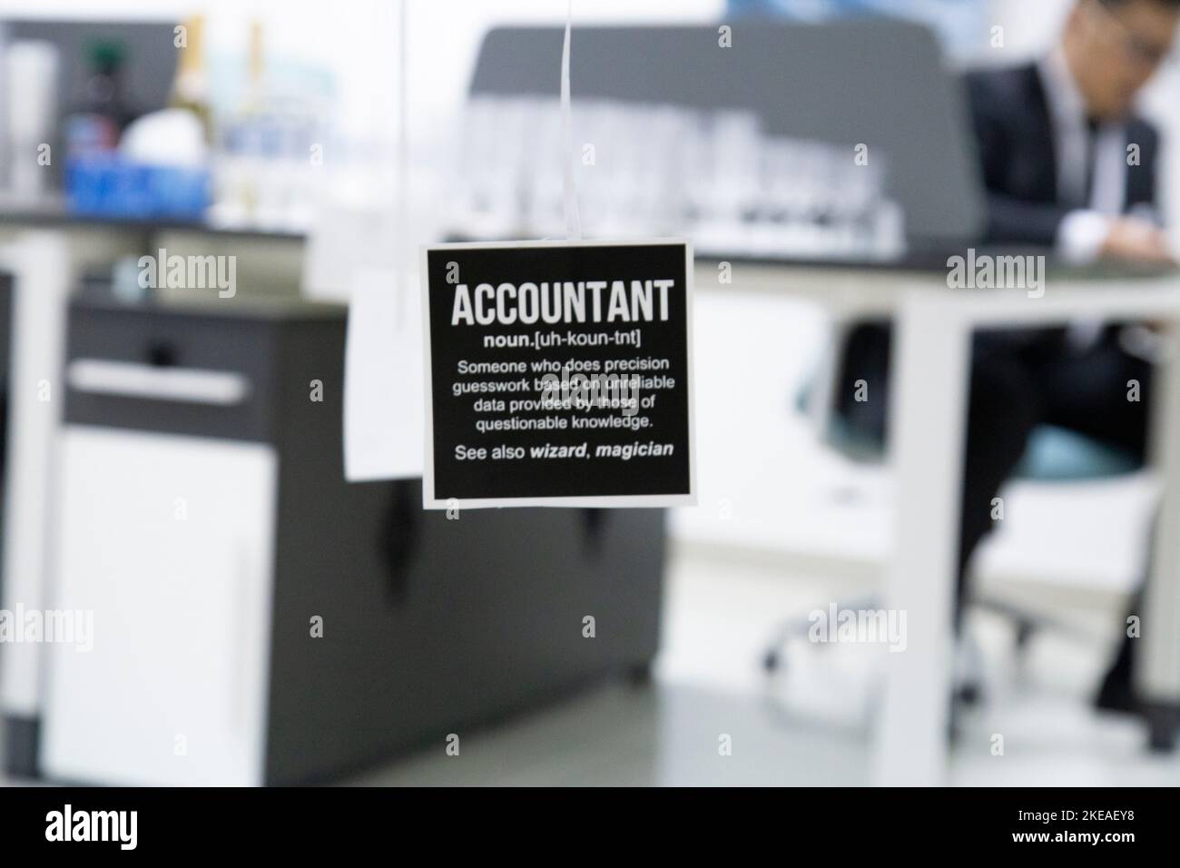 inspirational quote on string with office at back Stock Photo - Alamy