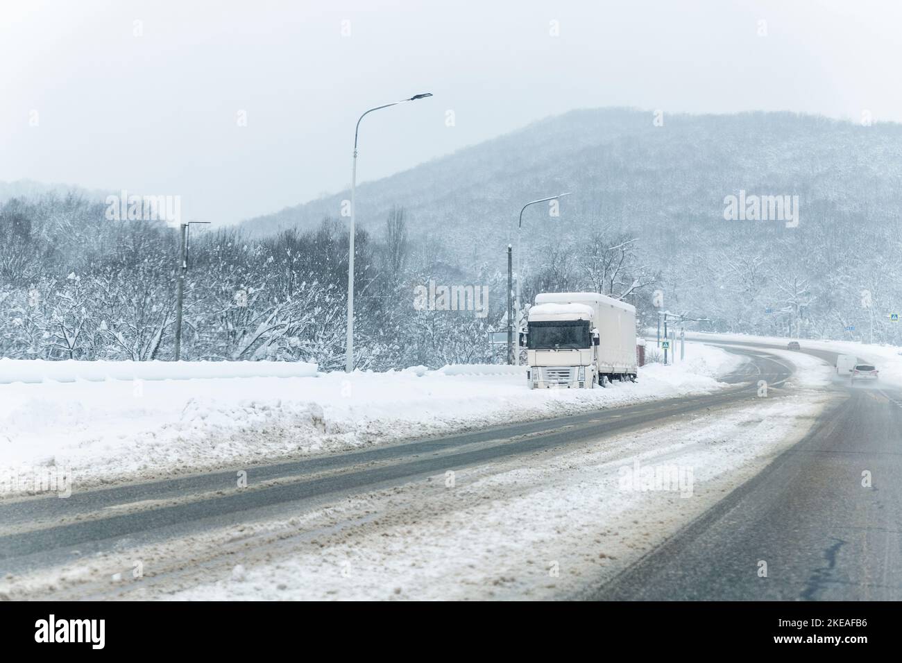 Big commercial semi-trailer truck trapped in snow drift on closed ...